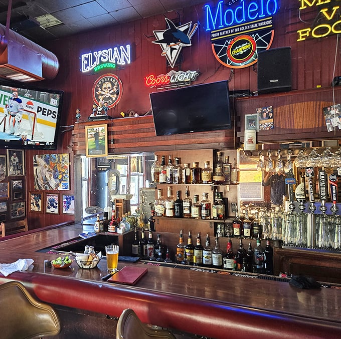 The bar at Henry's isn't trying to reinvent drinking—it's perfected the art of the straightforward pour in an atmosphere where everybody might actually know your name.