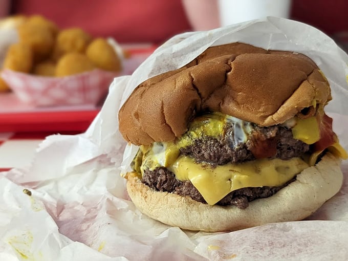 This isn't just a cheeseburger—it's a masterclass in American comfort food. Two patties, melted cheese, and a soft bun that yields with each bite.