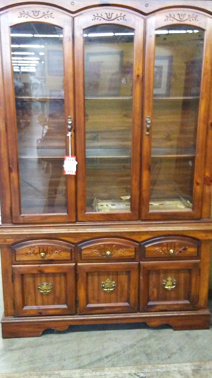 This china cabinet holds more than dishes – it's a portal to Sunday dinners at grandma's house.