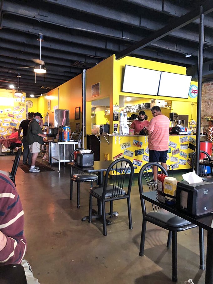 The bright yellow ordering counter—where dreams are spoken aloud and returned as edible happiness just minutes later.