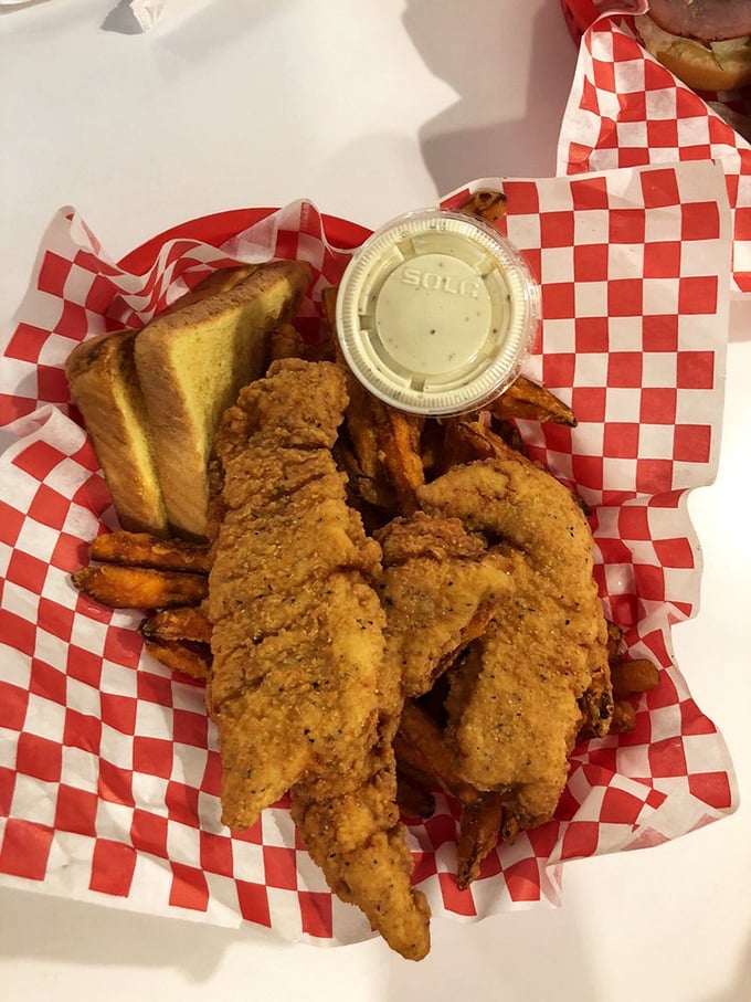 Chicken tenders that actually taste like chicken—what a concept! Paired with Texas toast and dipping sauce for a trifecta of comfort.