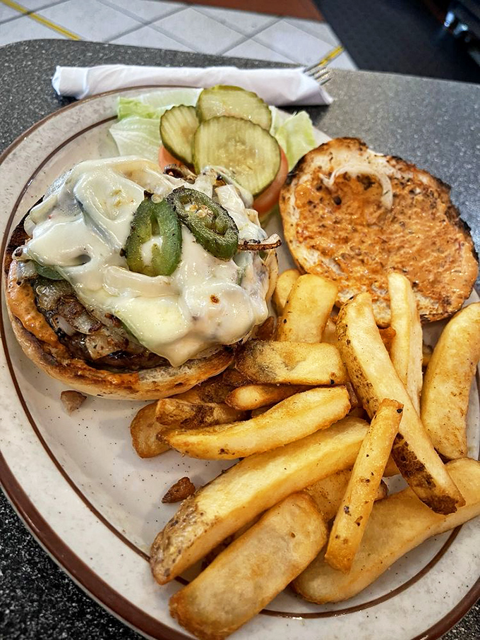 Jalapeños and melted cheese transform this burger into a spicy masterpiece that makes your taste buds feel like they've won the flavor lottery.