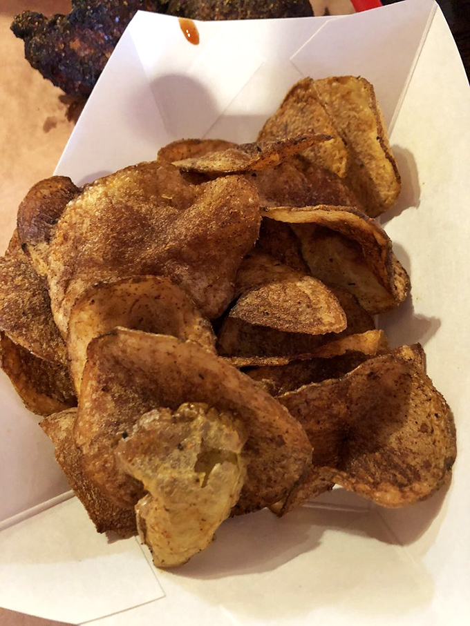 House-made potato chips that crackle with personality and seasoning, proving that even the supporting cast deserves a standing ovation.