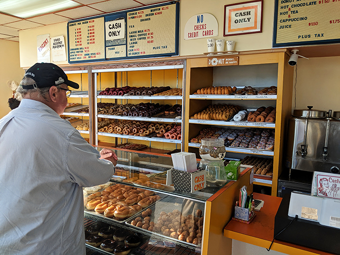 The counter where dreams come true and diets go to die. Notice the "Cash Only" sign—some traditions never change.
