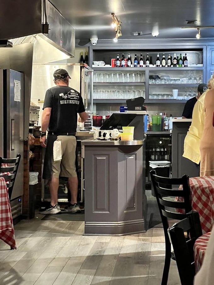 The bar area isn't just functional—it's command central for an operation that takes steak more seriously than most people take their careers.