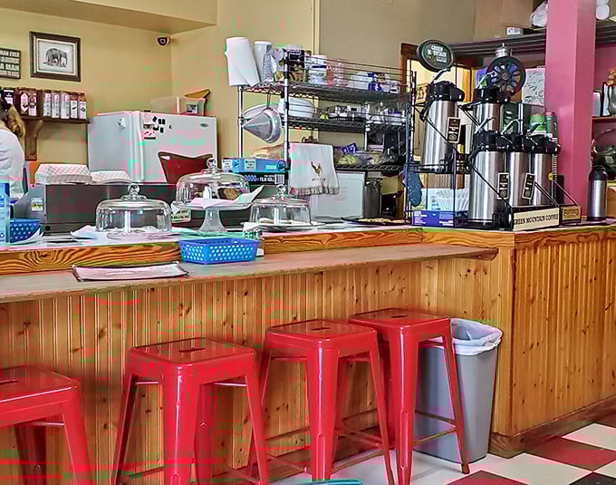 Red stools at a wooden counter—the universal invitation to belly up, order something delicious, and maybe leave with a new friend or two.