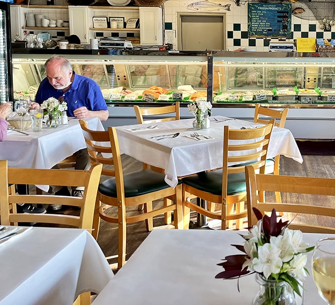 Where seafood dreams and reality meet—the fish market counter. That gentleman knows he's about to experience something worth the drive to Monterey.