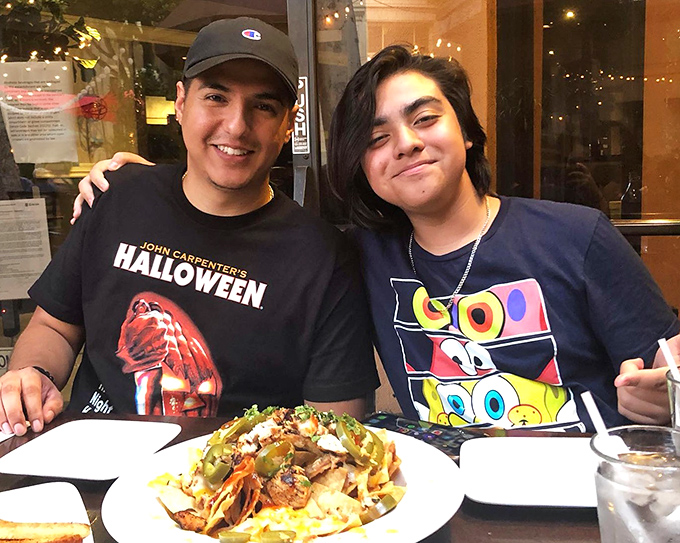 Happy diners sharing a moment that perfectly captures why we eat out – it's never just about the food, but the connections made across the table.