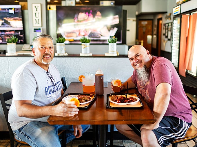Happy diners proving that good barbecue is the universal language of contentment and loosened belts.