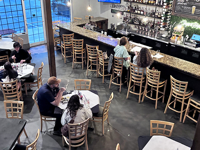 The bar area beckons with enough bottles to make any happy hour genuinely happy.