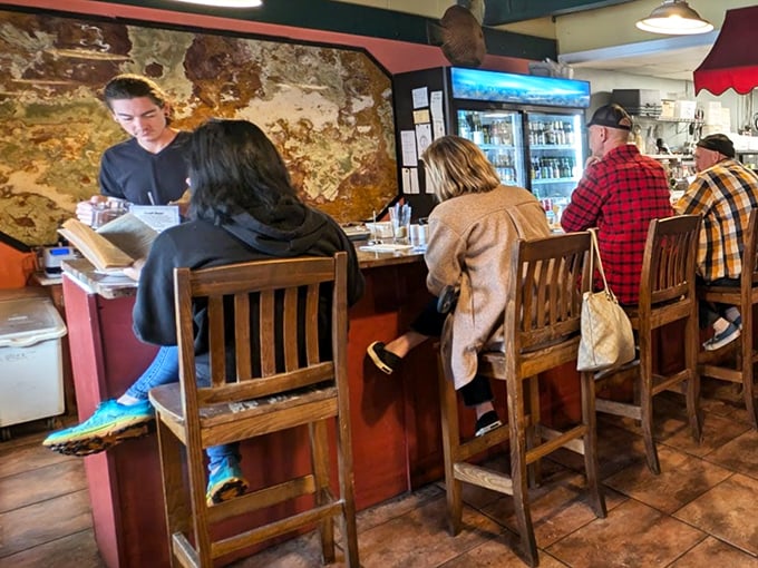 The counter seating isn't just a place to eat—it's front-row tickets to the Mediterranean culinary show.