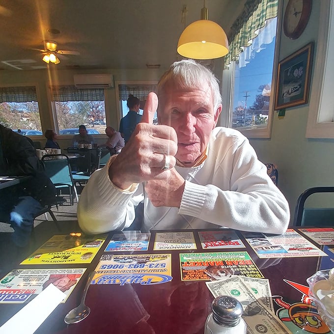 The universal thumbs-up—international symbol for "I've found food paradise." This gentleman knows what Missouri dining is all about.