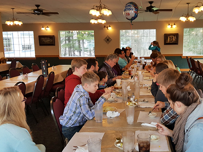 Multi-generational dining at its finest—where birthday balloons hover above tables of families sharing both food and stories.