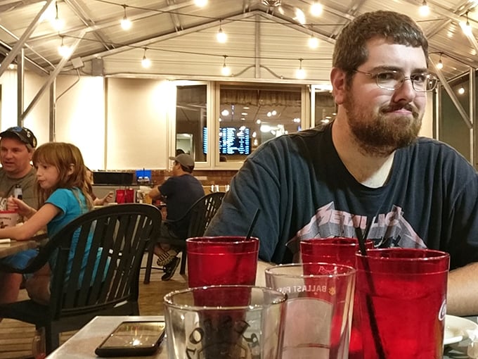 The dining area buzzes with the universal language of good food—notice how nobody's looking at their phones when there's pizza around.