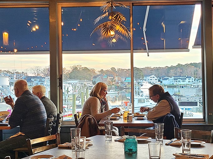 The true magic of dining—happy people sharing food with a million-dollar view of Rudee Inlet as their backdrop.