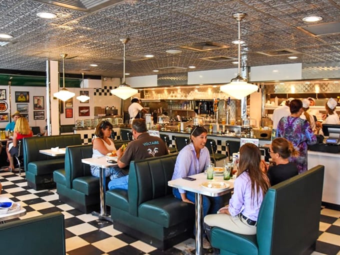 The bustling interior hums with conversation and clinking silverware – a symphony of satisfaction conducted under pressed tin ceilings.