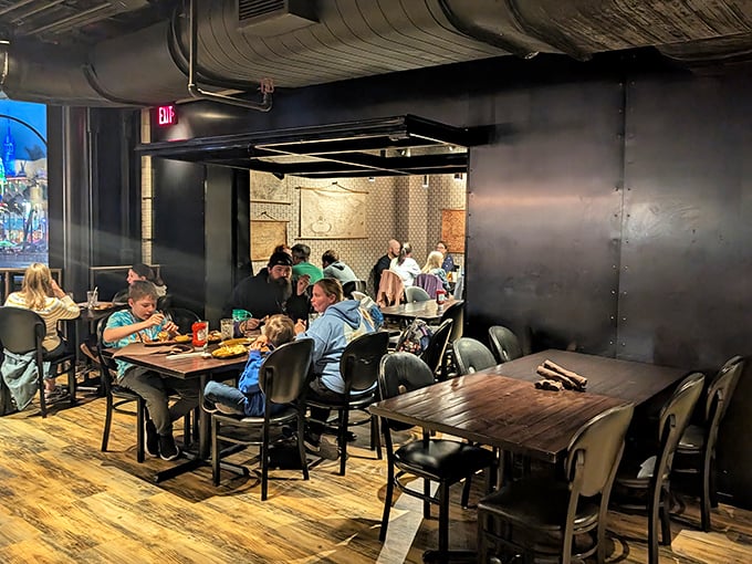 Families dining in what feels like the engine room of a delicious chocolate-powered airship. Industrial chic meets comfort in this clever dining space.