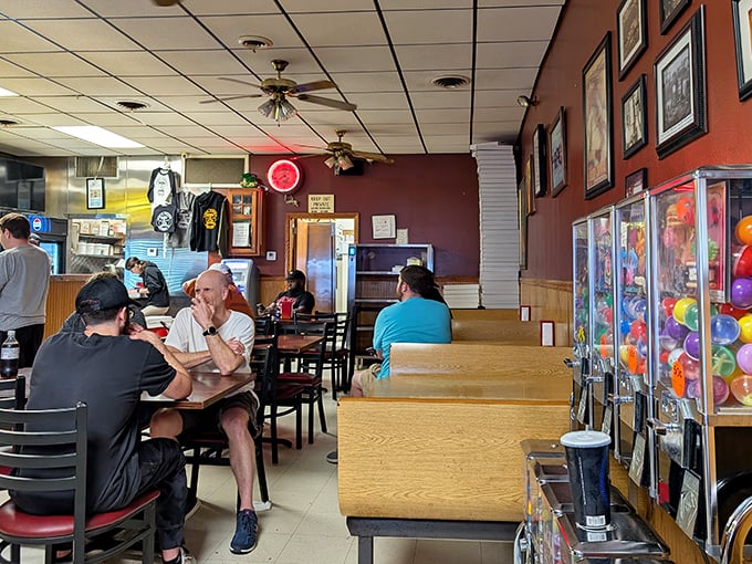 The universal language of pizza bringing strangers together. In this dining room, everyone's united by the pursuit of the perfect slice. 
