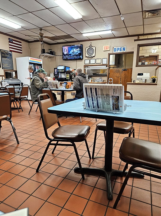 Where conversations flow as freely as the coffee. Notice the menu holders – no QR codes necessary in this timeless space.