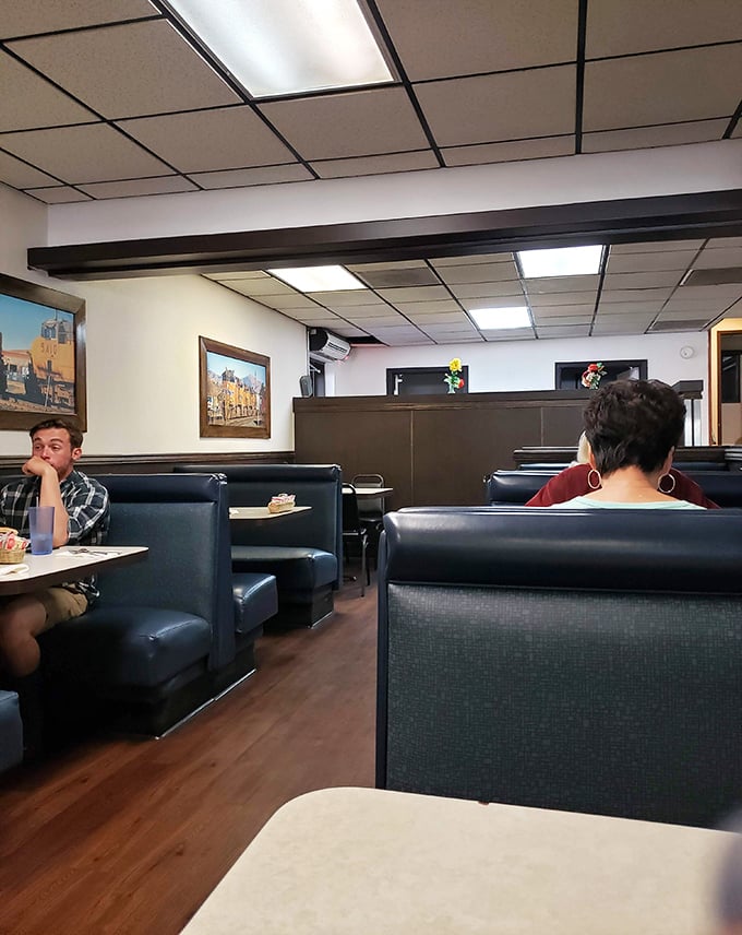 The dining room speaks volumes about priorities: comfortable booths, simple decor, and all focus directed where it should be—on the food and company.