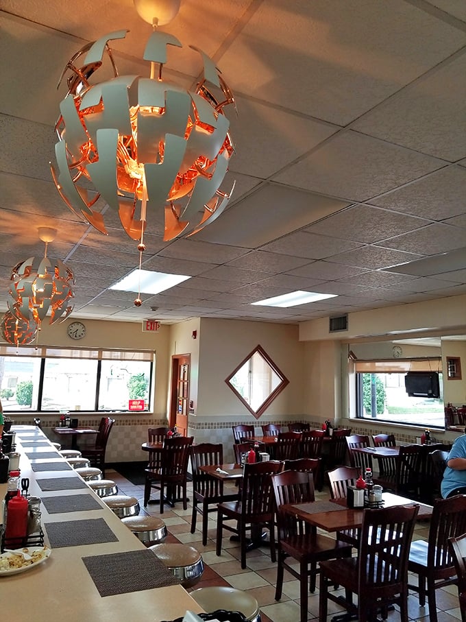 Those sphere-shaped light fixtures add just enough personality without trying too hard – breakfast spots should feel comfortable, not stuffy.
