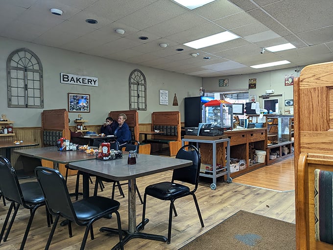 The dining area whispers "stay awhile" with its unpretentious charm and church-window accents that frame many a morning revelation.