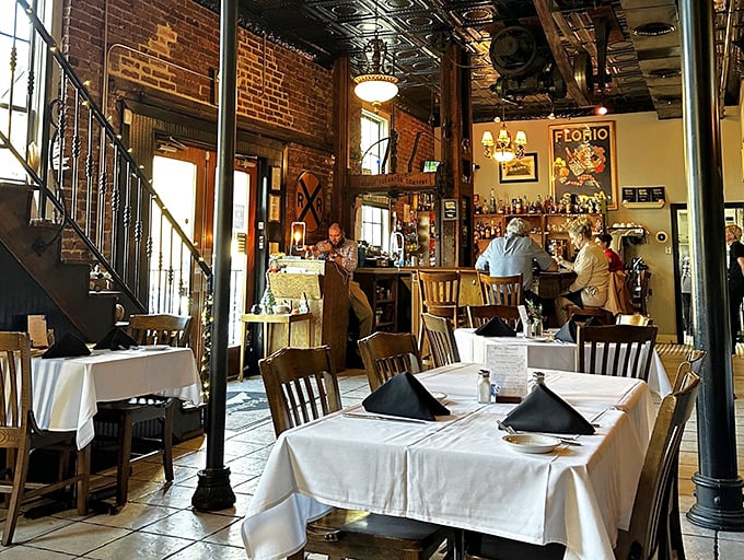 The dining room feels like a secret club where the password is "good taste"—white tablecloths signal serious food in a space that never takes itself too seriously.