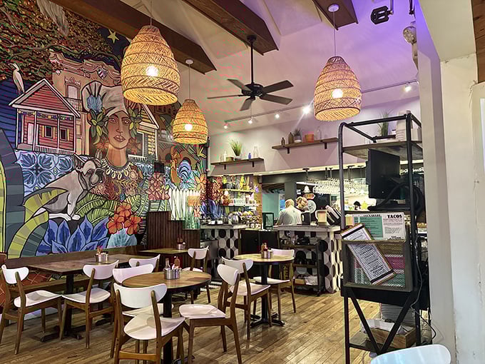 The dining room feels like the creative lovechild of a beach cottage and an art gallery, where every seat offers a different perspective on that spectacular mural.