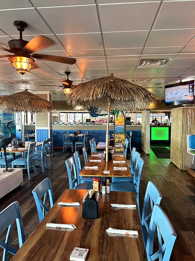 The dining room whispers "Yes, you're really in Florida" with every thatched umbrella and blue chair – casual elegance with a side of sea breeze.