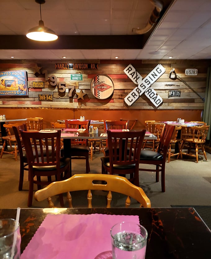 The dining room wall tells stories through vintage signs and memorabilia—each one a conversation starter better than any dating app icebreaker.