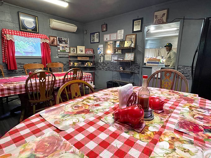 Inside Jones Bar-B-Q, where red-checkered tablecloths and simple wooden chairs create the perfect stage for the star of the show – that legendary pork.
