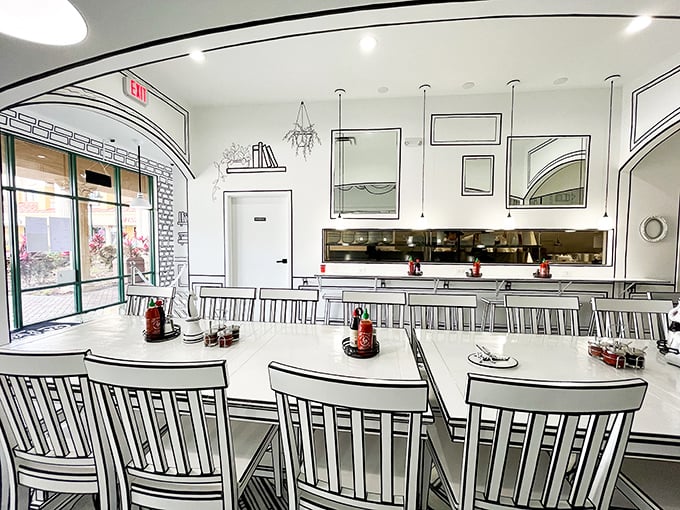 Communal dining with a view of the kitchen—dinner and a show in one. Those pendant lights are like jewelry for the ceiling.