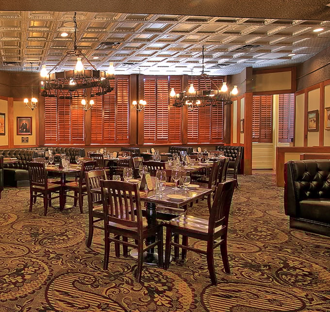 The dining room balances Western heritage with understated elegance—those ornate tin ceilings have witnessed countless celebrations and business deals.