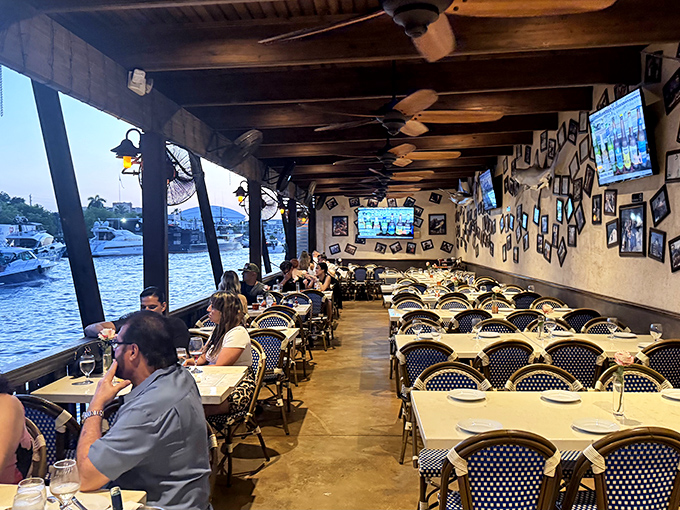 Dining with a view that turns every meal into an occasion—boats gliding by as if choreographed for your entertainment.