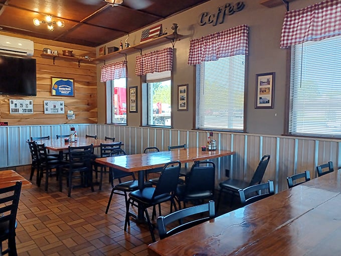 Red-checkered curtains and wood-paneled walls create that "come as you are" atmosphere where both farmers and bankers feel equally at home.