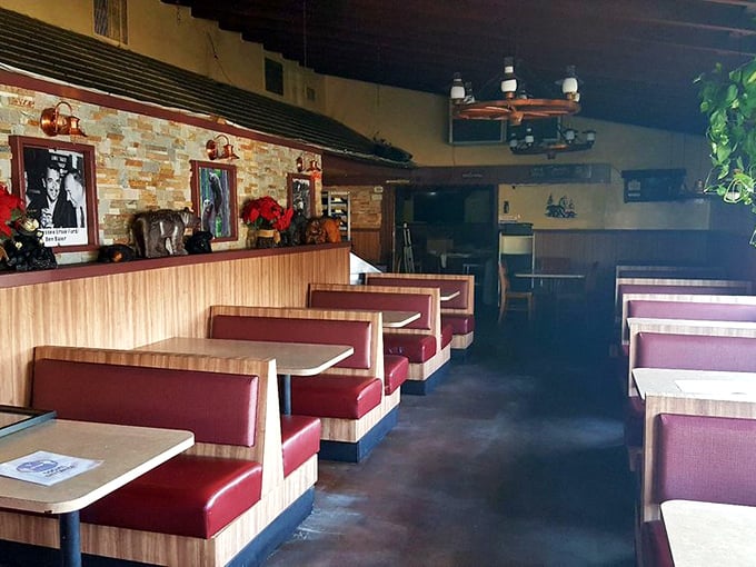 Red vinyl booths and wood paneling—the classic American BBQ joint uniform. Some design trends never need updating.