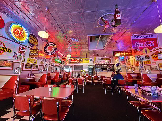 The dining area isn't decorated—it's curated, a museum of Americana where every neon sign tells a story and every booth has heard secrets. 