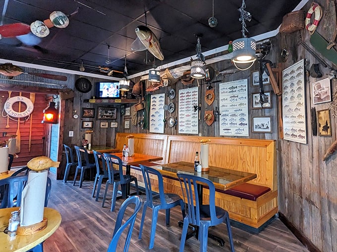 Fishing memorabilia adorns wooden walls while simple tables await hungry travelers. No pretension here—just a space dedicated to Great Lakes seafood worship.