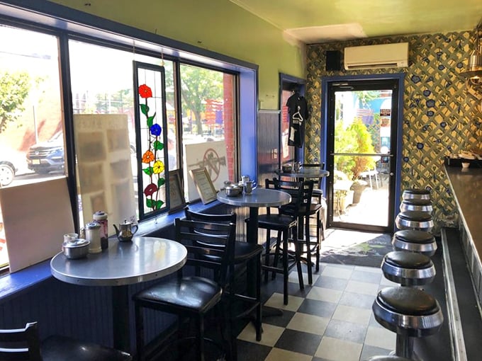 Stained glass flowers dance in the morning light while diners plot their attack on plates of morning glory. Breakfast as theater-in-the-round.