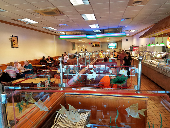 The dining area balances functionality with touches of charm—those decorative fish tanks saying "Yes, our seafood is fresh, why do you ask?"