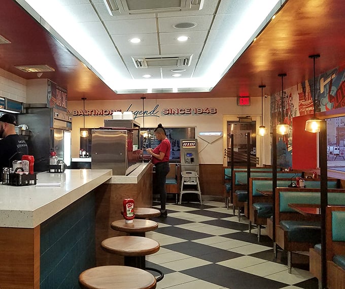 Counter seating and turquoise booths create that perfect nostalgic atmosphere where calories don't count and coffee refills appear like magic.