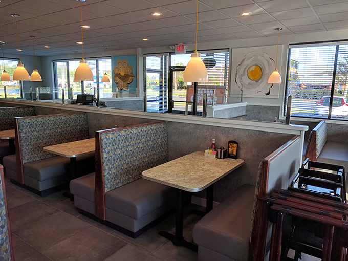 Booths designed for comfort, not Instagram. The kind of place where "just one more coffee" turns into solving all the world's problems by noon.