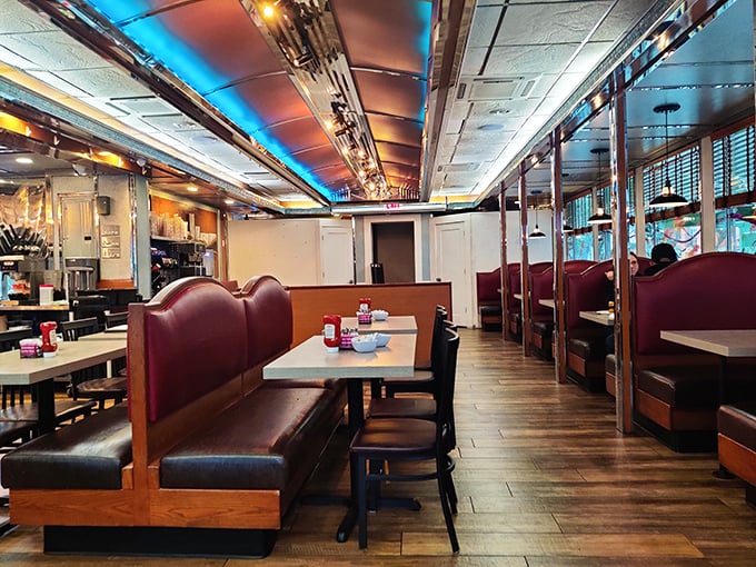 Red vinyl booths, polished chrome, and ceiling lights that flatter everyone—this dining area has witnessed first dates, family celebrations, and countless "just one more coffee" moments.