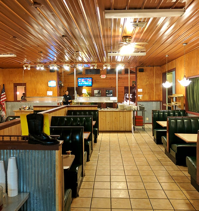 Wood paneling, corrugated metal accents, and comfortable booths create the perfect backdrop for serious eating. This isn't dining—it's Southern communion.