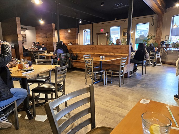 Wood, metal, and warm lighting create that perfect "stay awhile" atmosphere where breakfast easily stretches into brunch conversations.