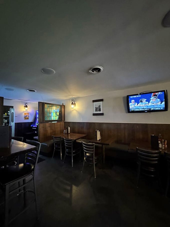 The dining area offers a cozy retreat with wood paneling and soft lighting—the perfect backdrop for serious wing consumption.