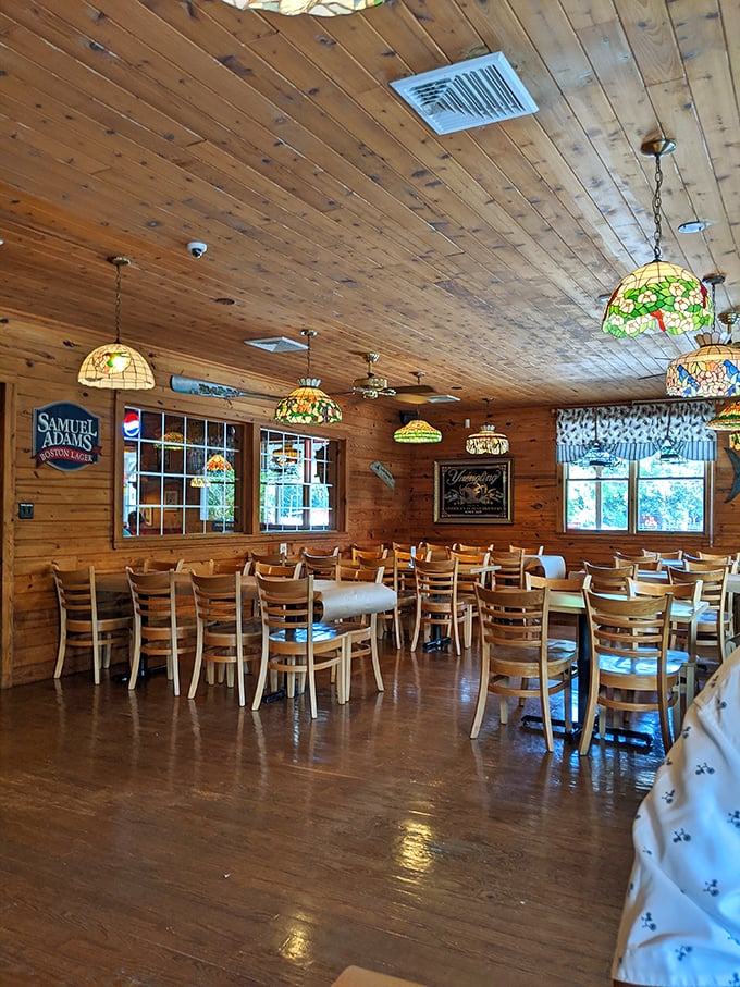 Wooden walls, stained glass pendant lights, and tables awaiting hungry guests—this dining room practically whispers "seafood memories will be made here."