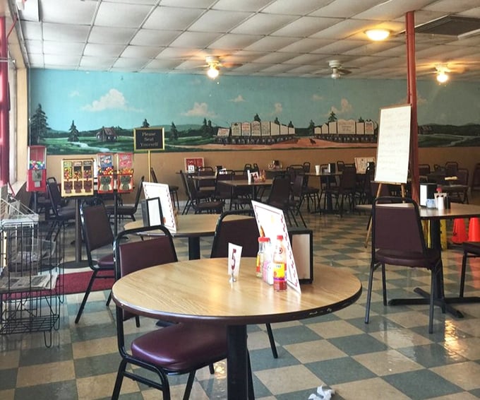 The dining room's pastoral mural and checkerboard floor create an atmosphere that says "stay awhile" – and with food this good, why wouldn't you?