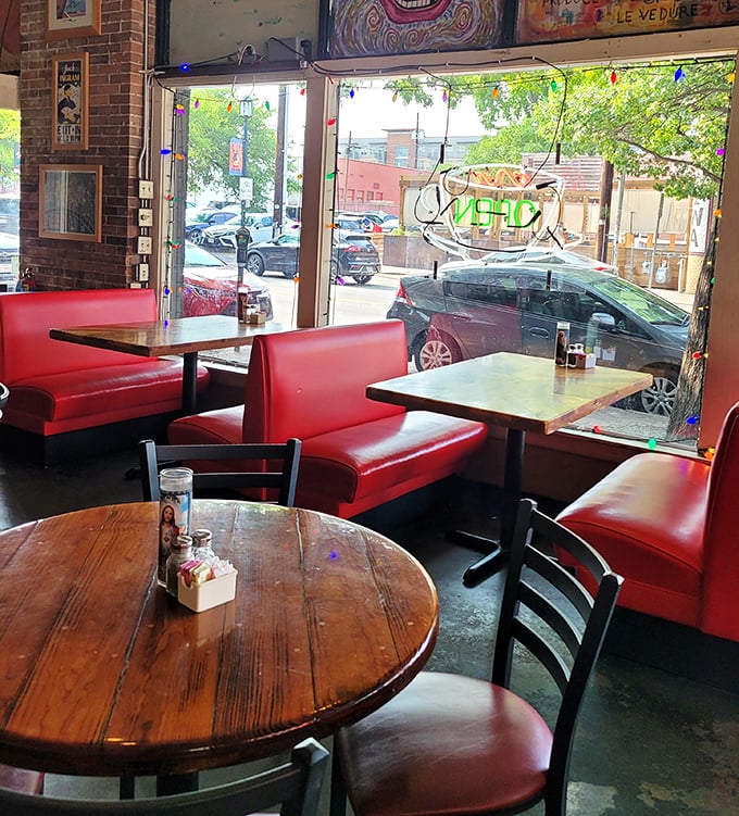 Red vinyl booths that have cradled countless conversations – where the morning light streams in and coffee refills appear like magic.