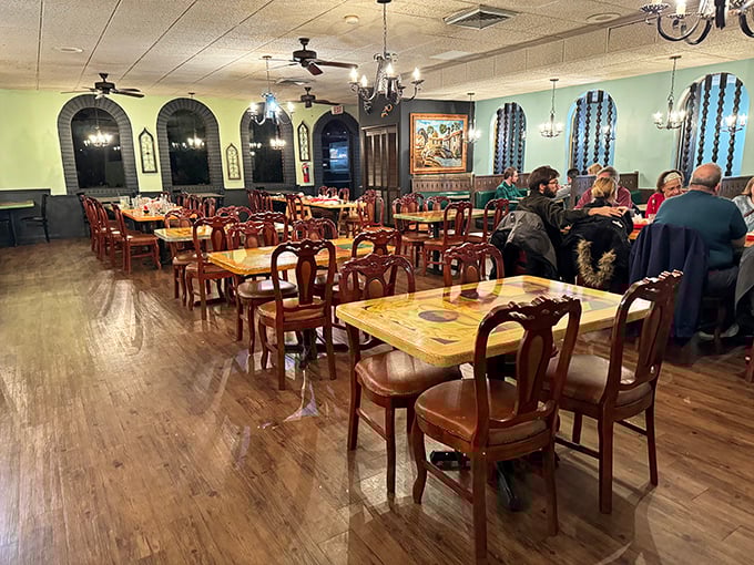 The dining room's arched windows and warm lighting make every dinner feel like a special occasion worth celebrating.